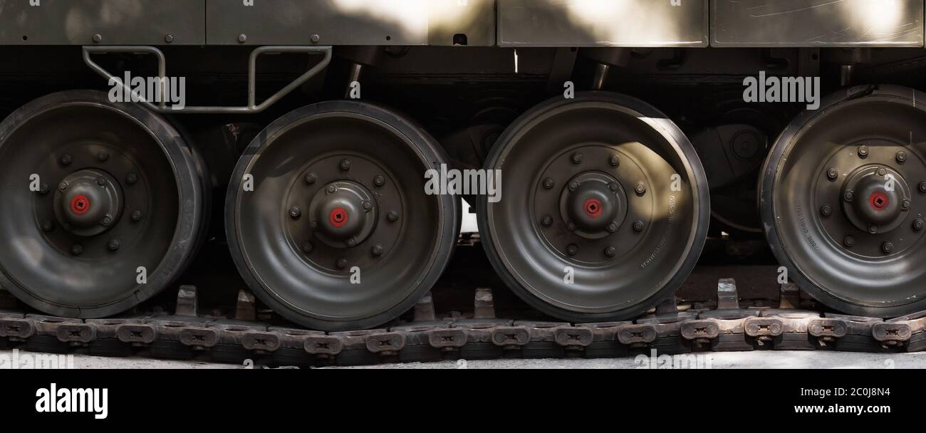 Tank truck and wheel closeup. Military background lateral part of heavy ...