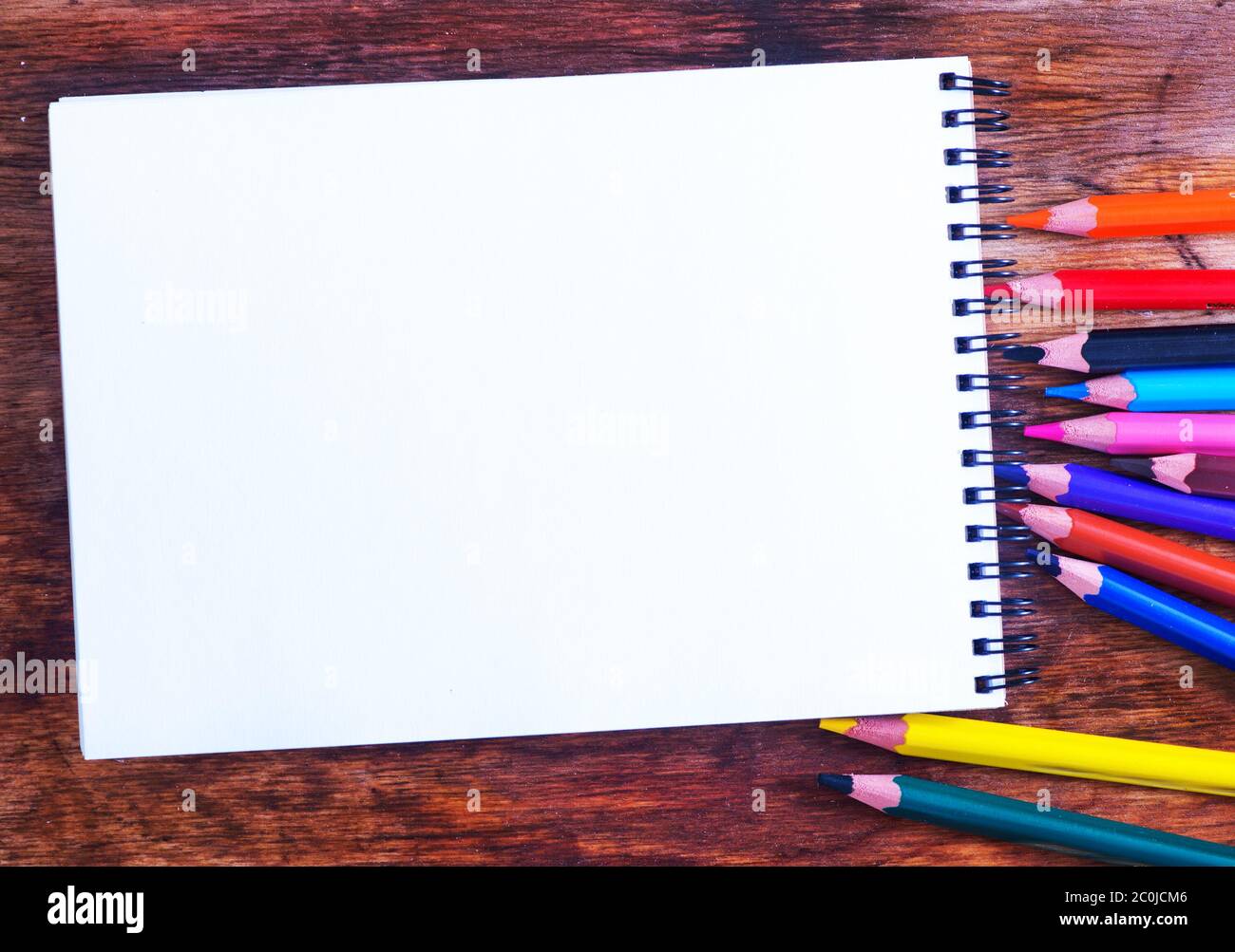 pencils and note Stock Photo - Alamy