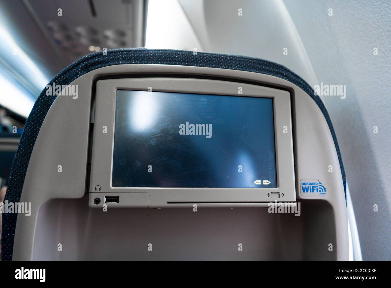 The interior of the aircraft. Empty airplane cabin. Rows of passenger ...