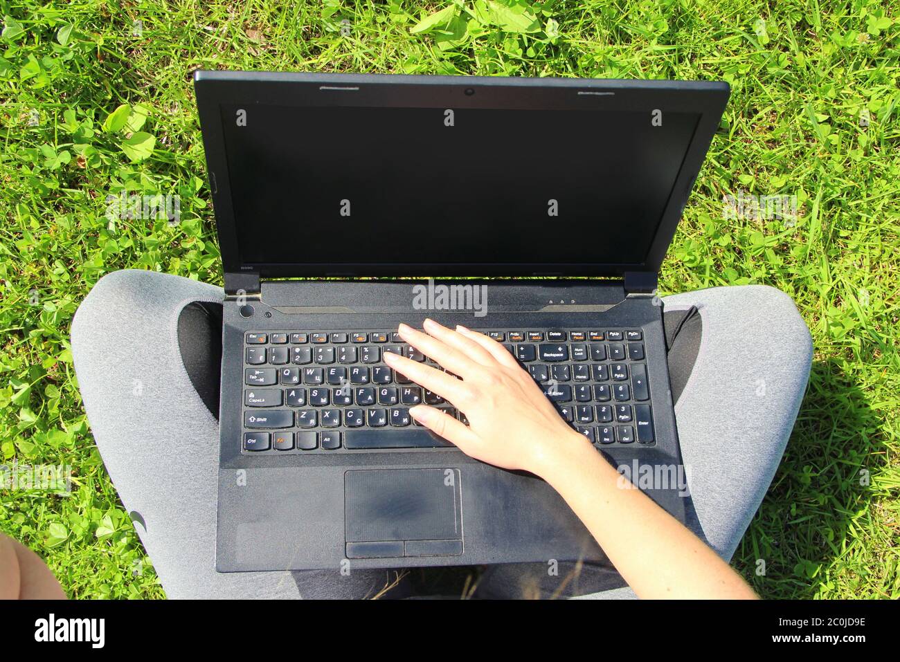 Laptop on lap black hi-res stock photography and images - Alamy