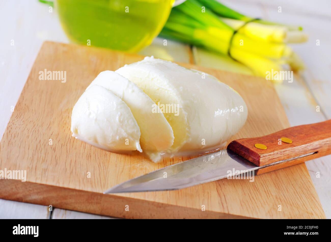 fresh mozzarella on the wooden board Stock Photo - Alamy
