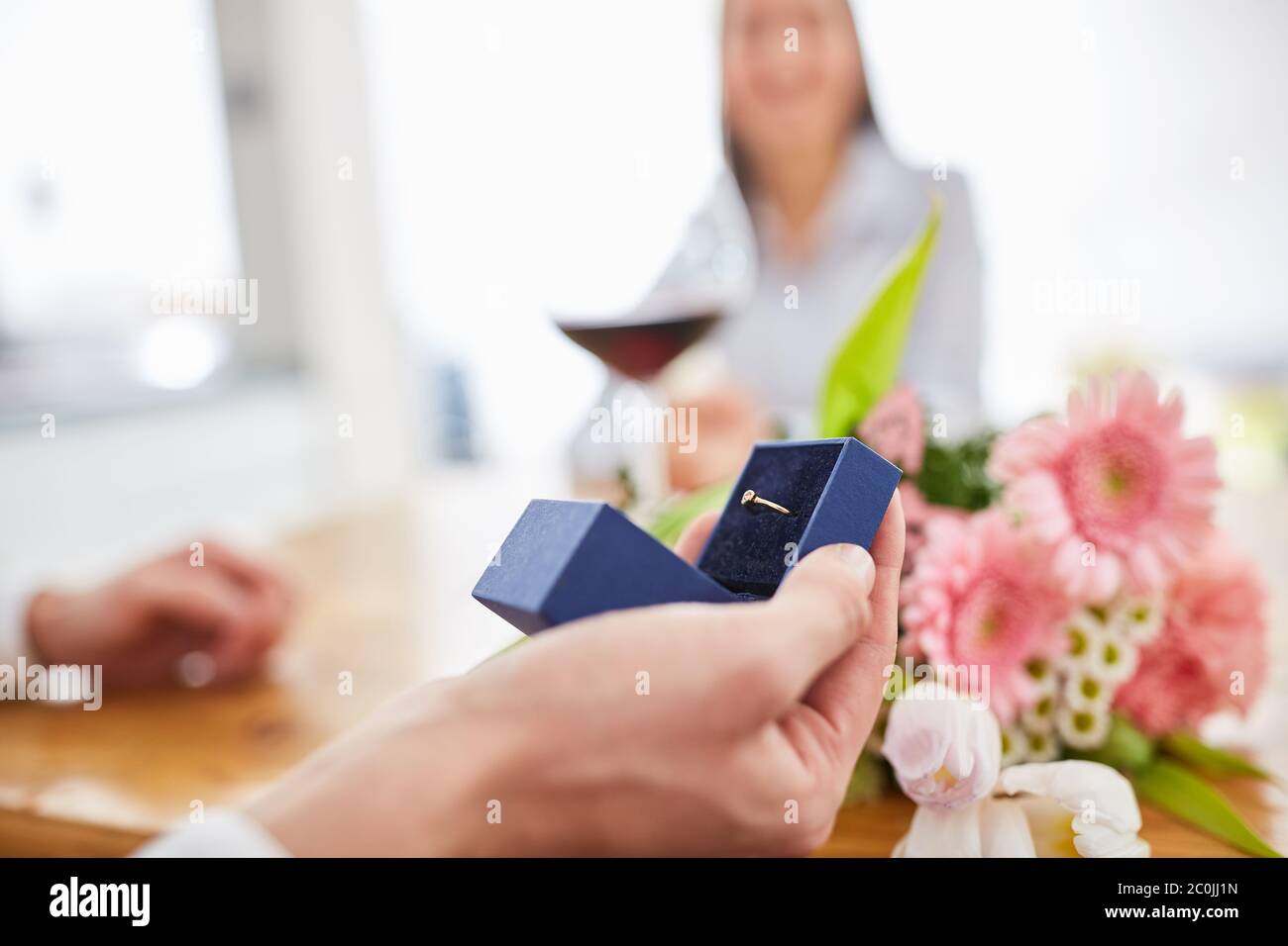 Hand of a man with wedding ring in box on marriage proposal on ...