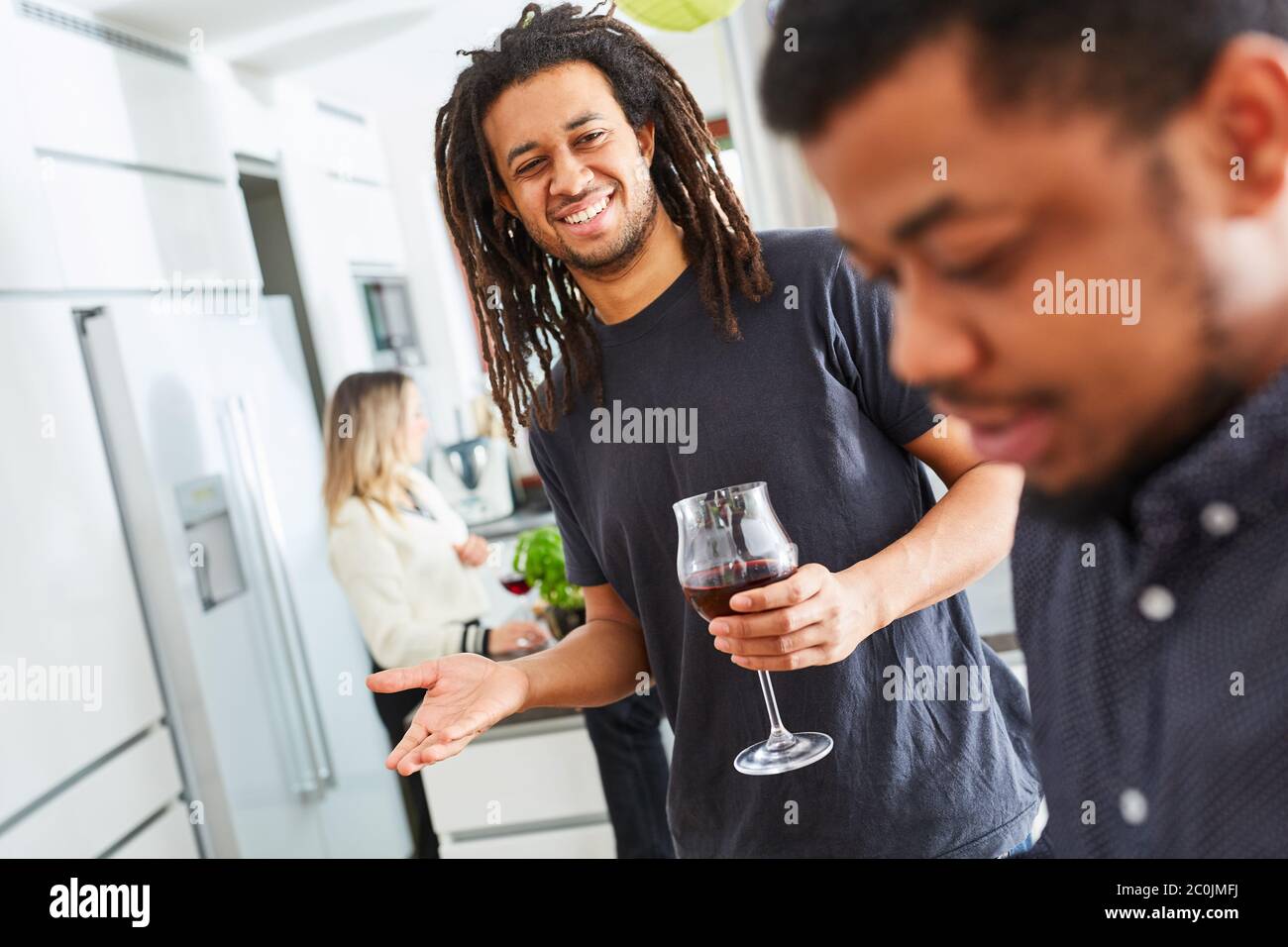 Happy friends together as students in shared kitchen before lunch Stock ...