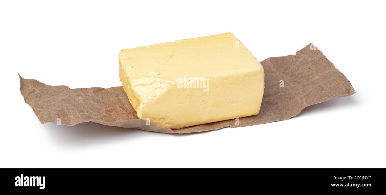 Fresh butter on craft paper isolated on white background Stock Photo ...