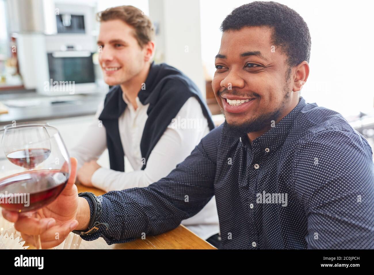 Two people having a glass of wine hi-res stock photography and images ...