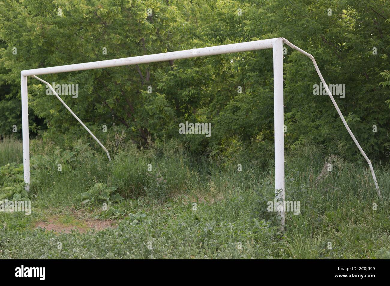 Old soccer football gate on field with green grass Stock Photo - Alamy