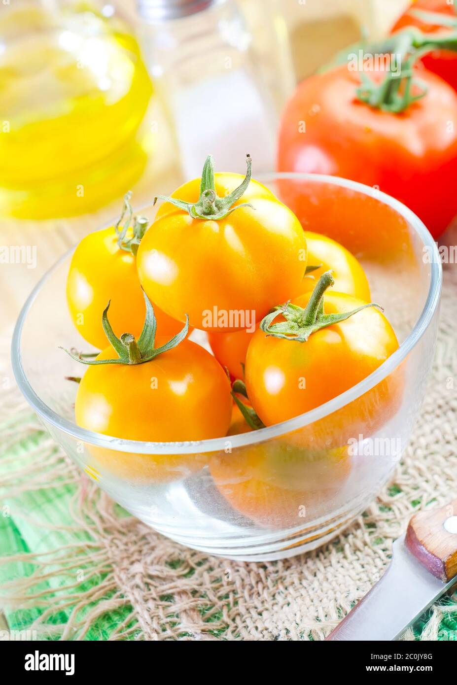 yellow tomato in the glass bowl Stock Photo - Alamy