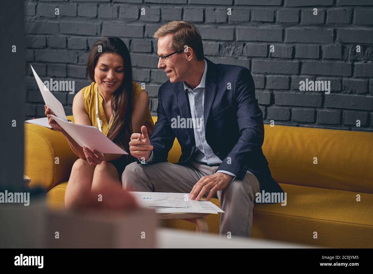 Kind mature man listening to his colleague Stock Photo - Alamy