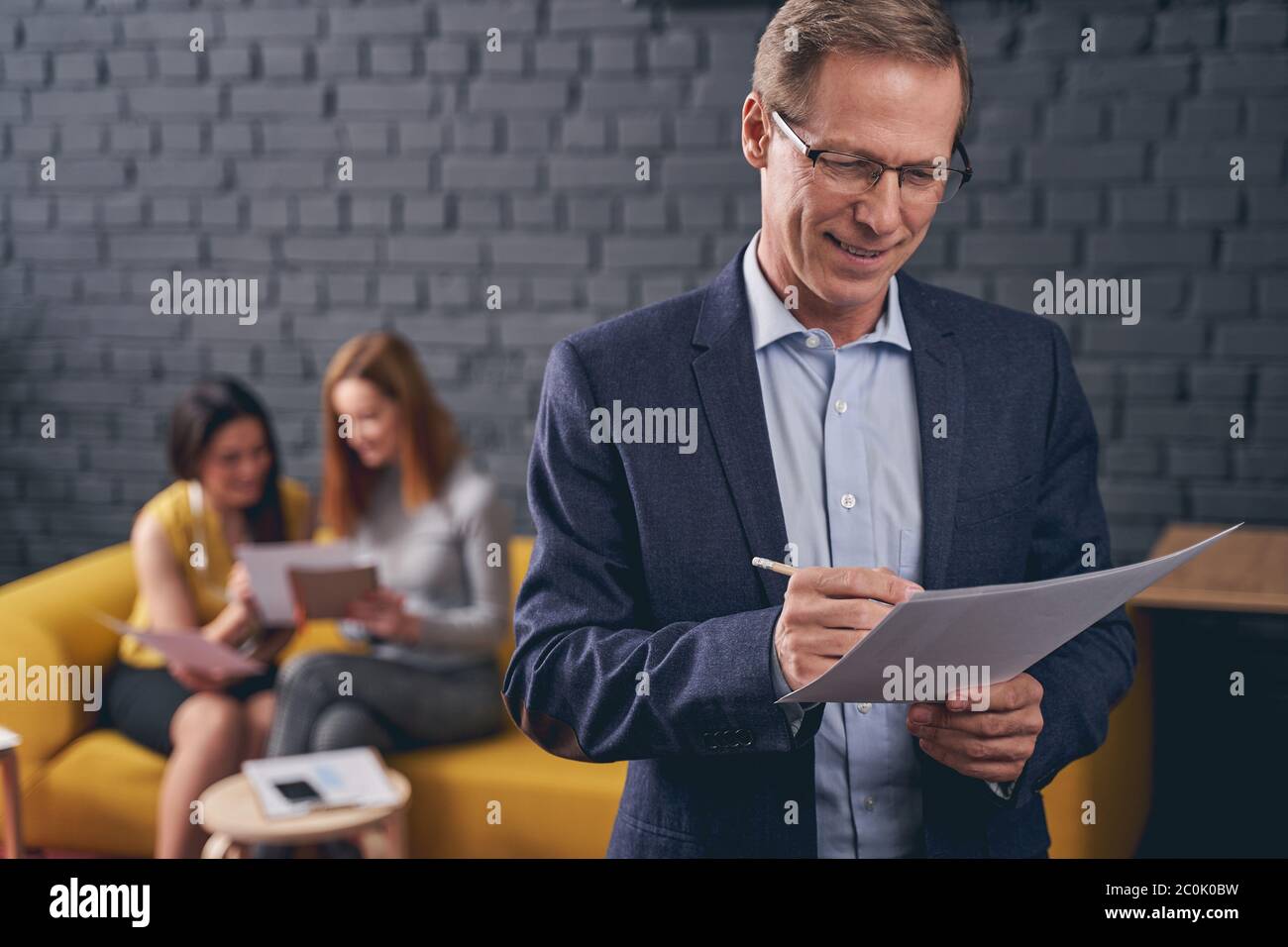 Male office manager checking documents hi-res stock photography and ...