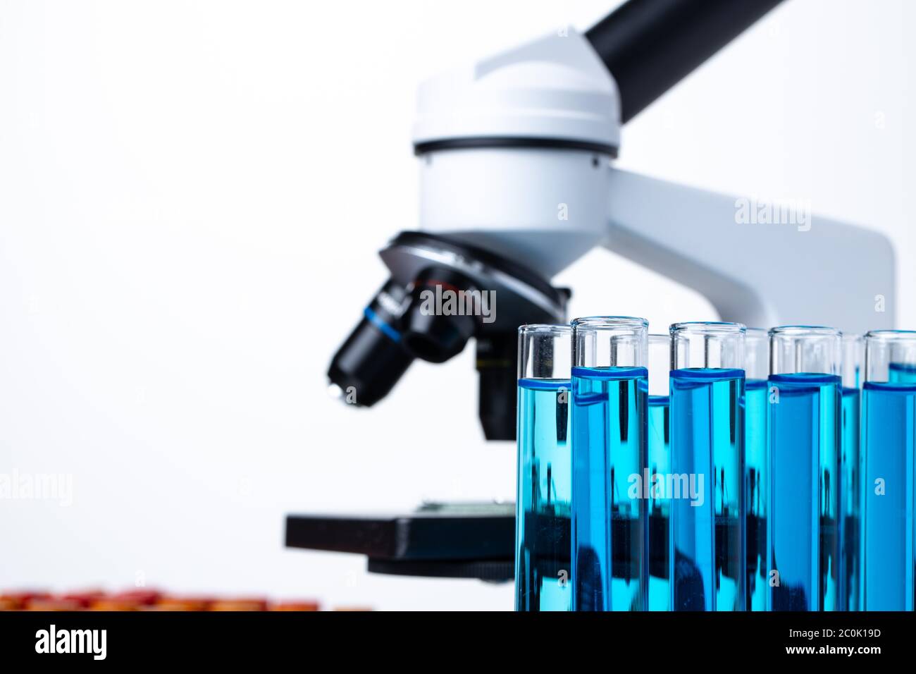 Microscope with test tubes for research close up Stock Photo - Alamy
