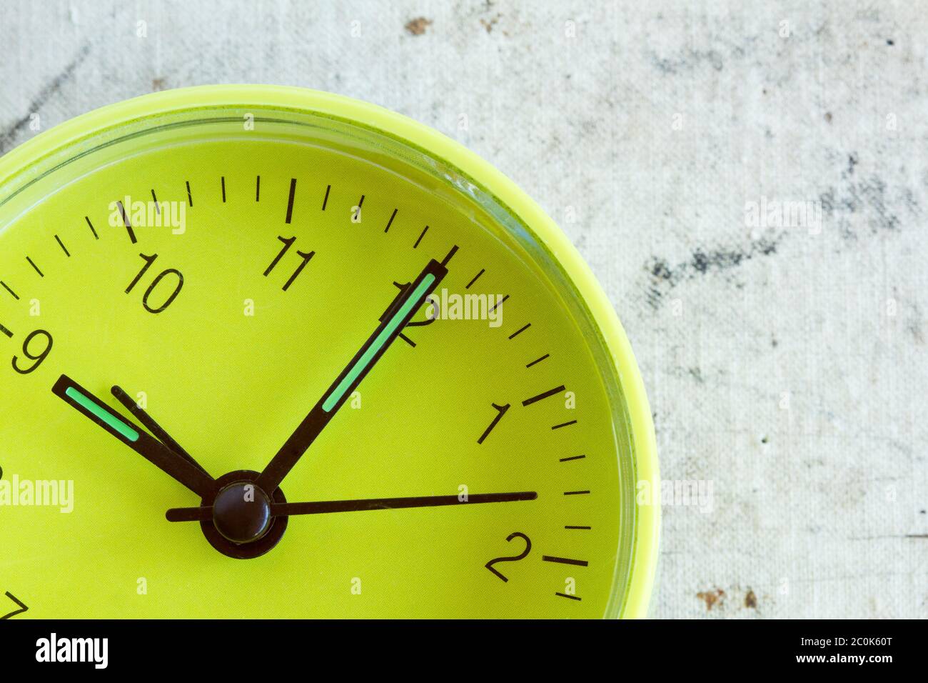 Green clock face over a dirty background Stock Photo - Alamy