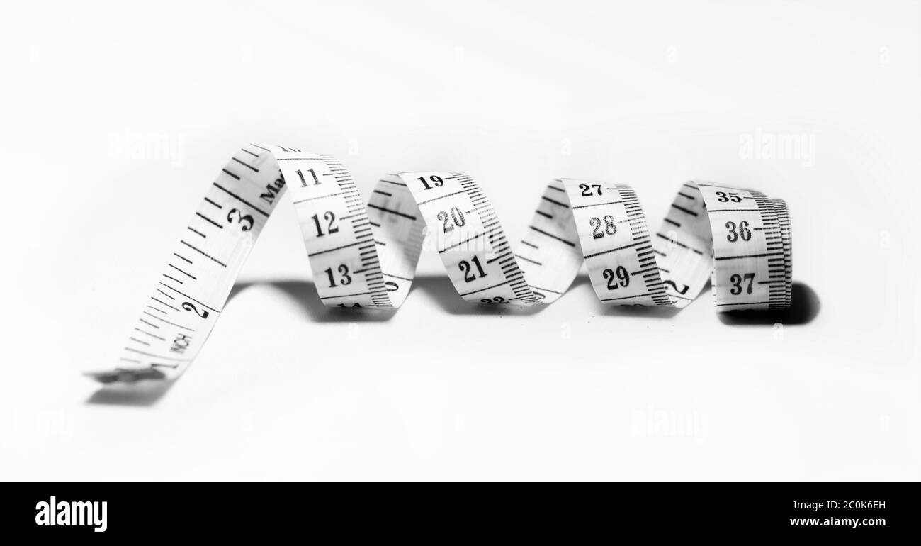 Photo of a white tape measure isolated Stock Photo - Alamy