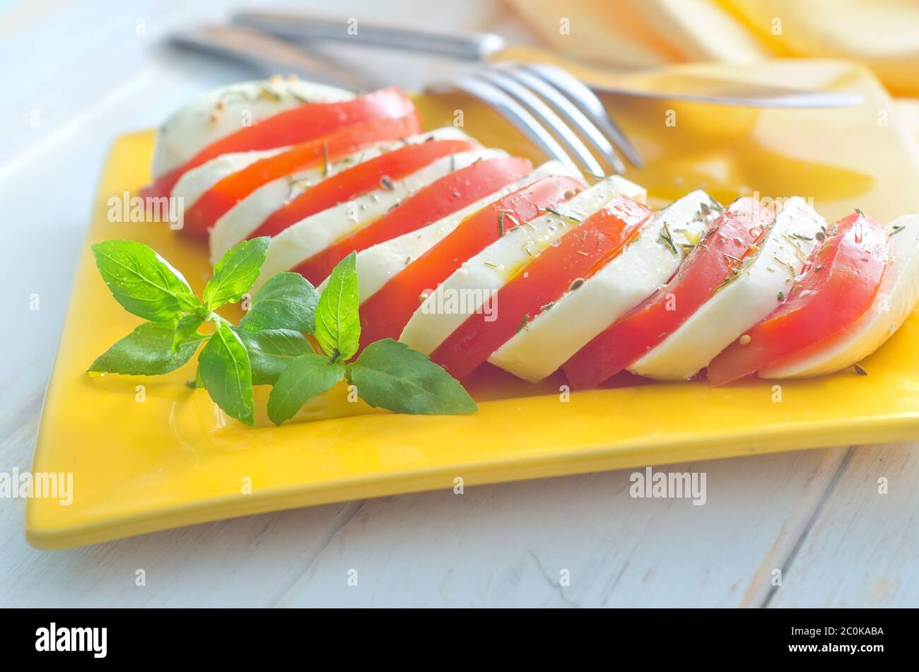 caprese, fresh salad with tomato and mozzarella Stock Photo - Alamy