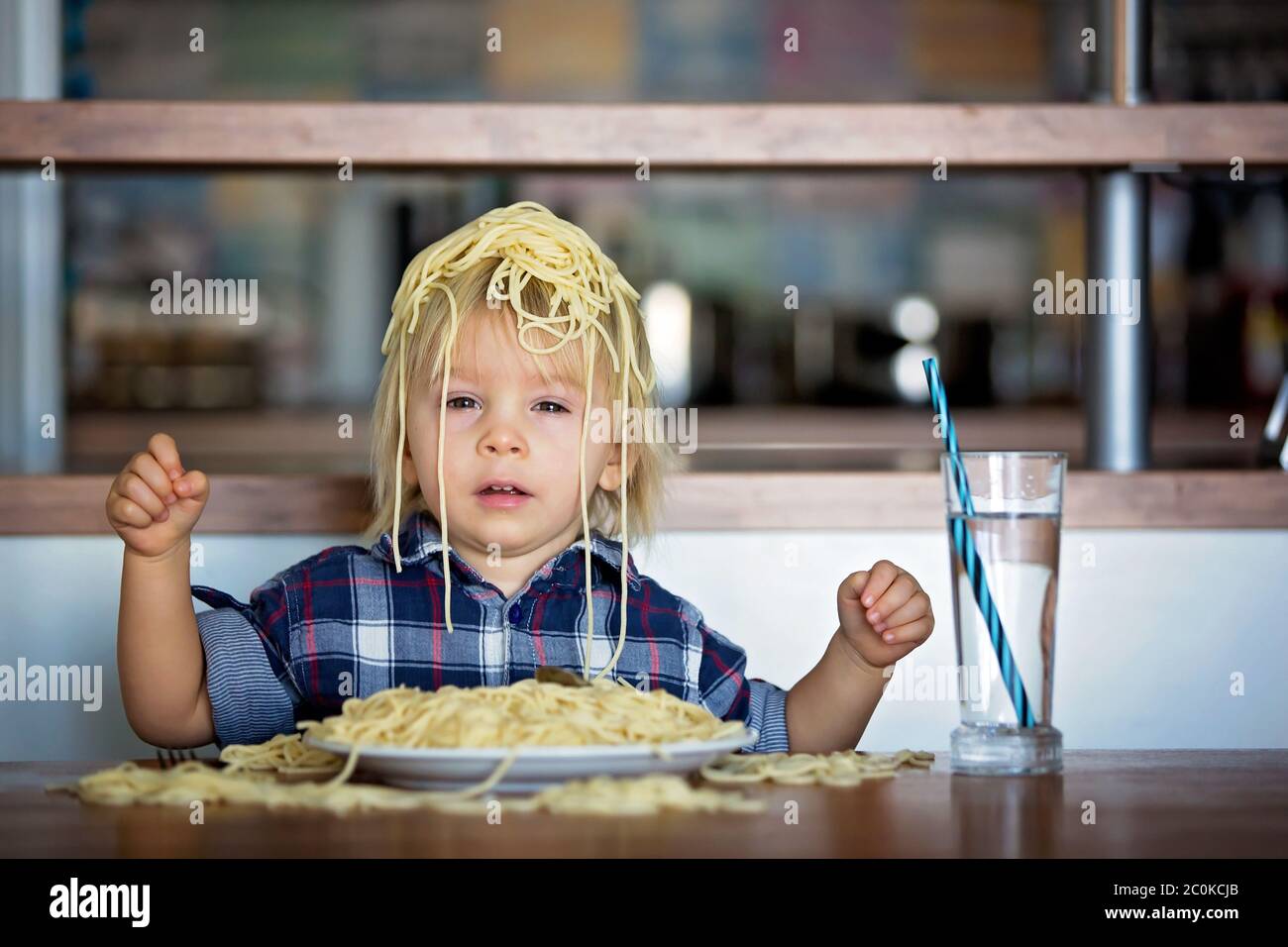 Boy eating messy spaghetti dinner hi-res stock photography and images ...
