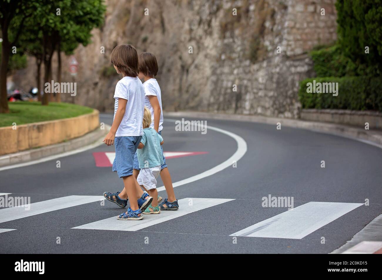 Family crossing crosswalk holding hands hi-res stock photography and ...