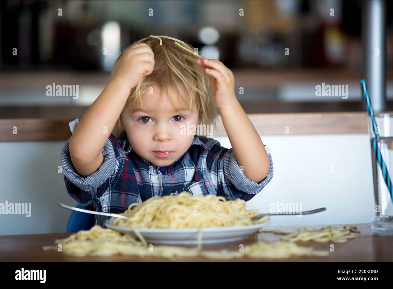 Boy eating messy spaghetti dinner hi-res stock photography and images ...