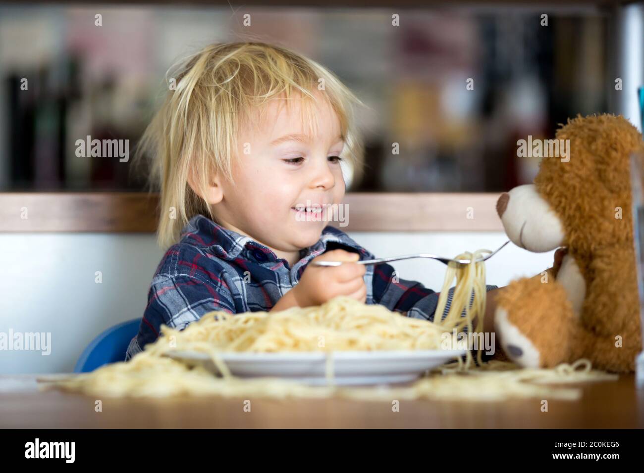 Messy baby boy eating spaghetti hi-res stock photography and images - Alamy