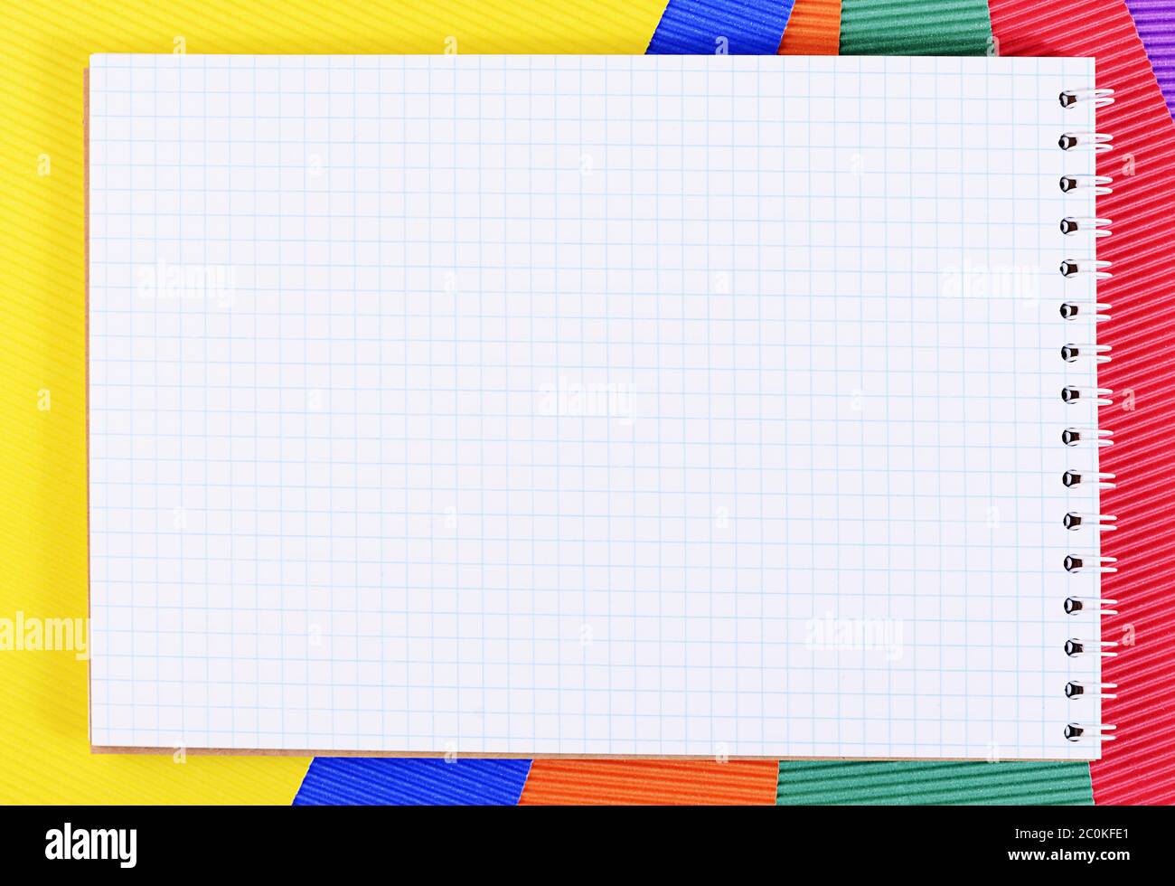 Writing-book in cage on color paper Stock Photo - Alamy