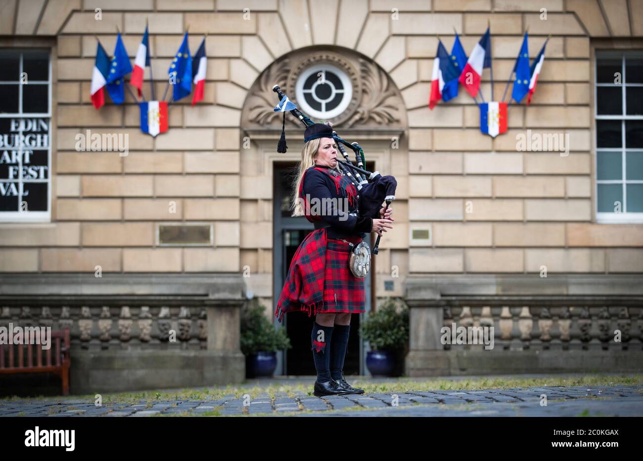 Piper Louise Marshall plays the pipers' march "Heroes of St Valery ...