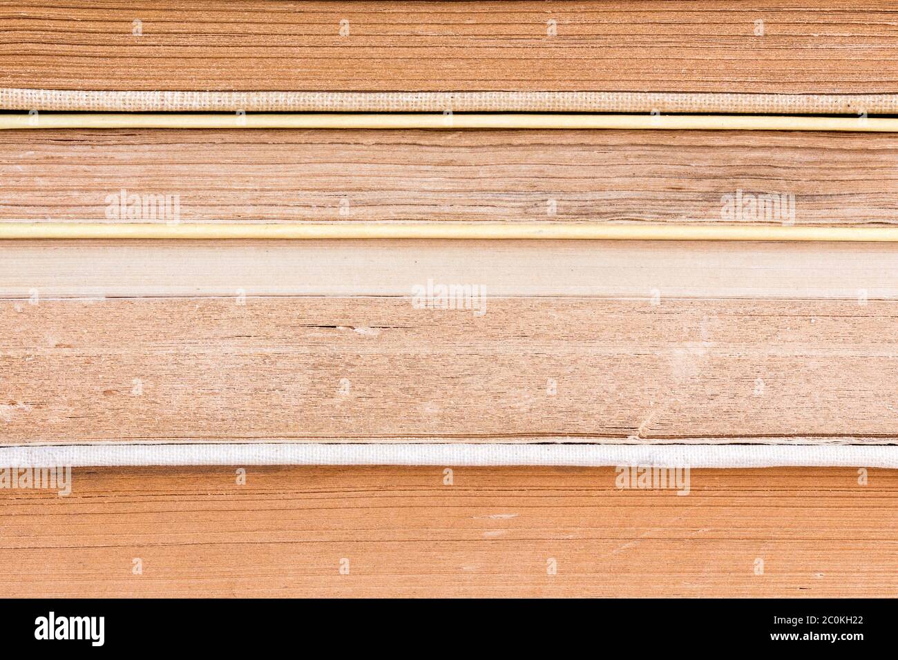 Side view of stacked books Stock Photo - Alamy