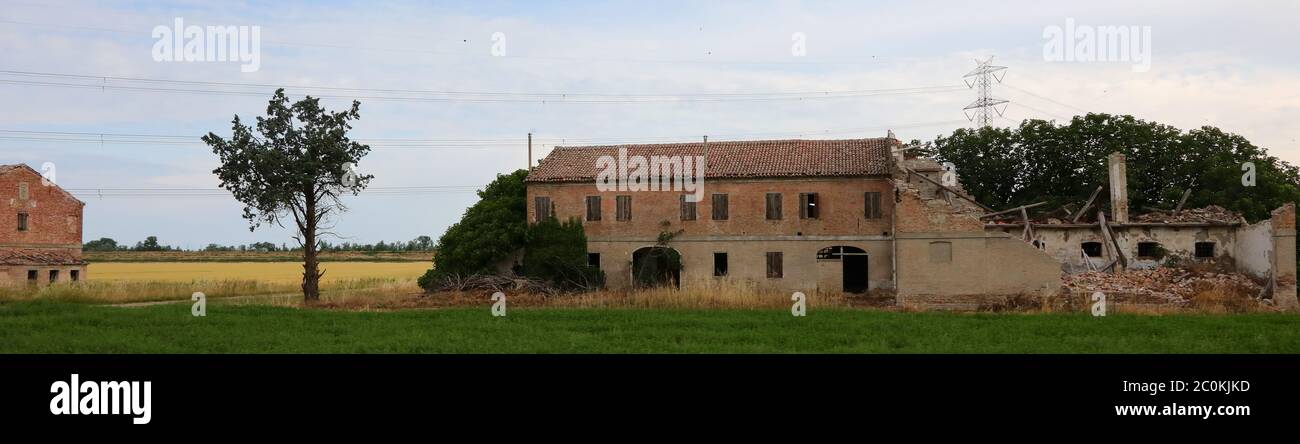 ruins of an abandoned and destroyed farm in the plain after the ...