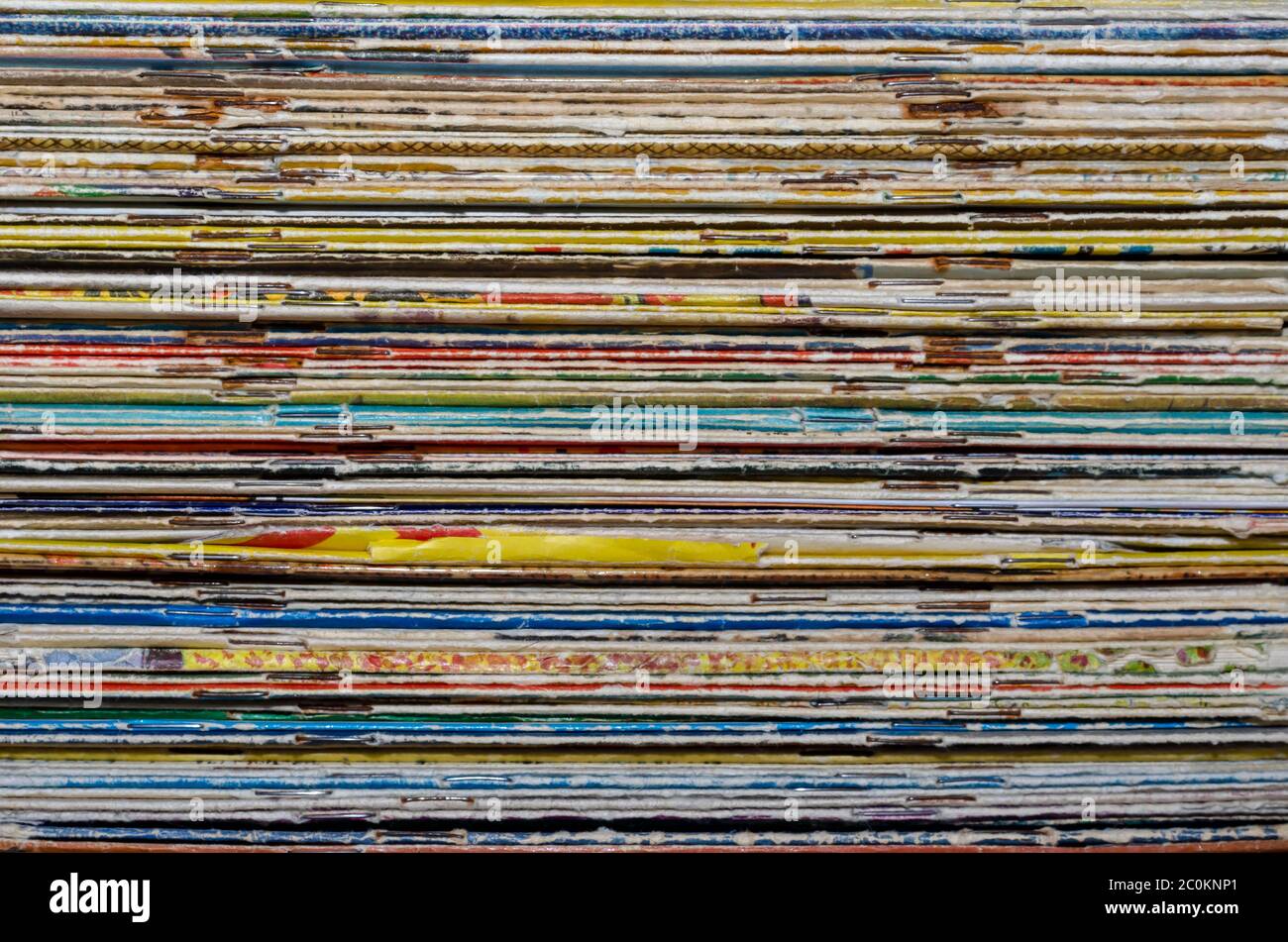 Texture of old magazines and comics. A stack of shabby old magazines ...