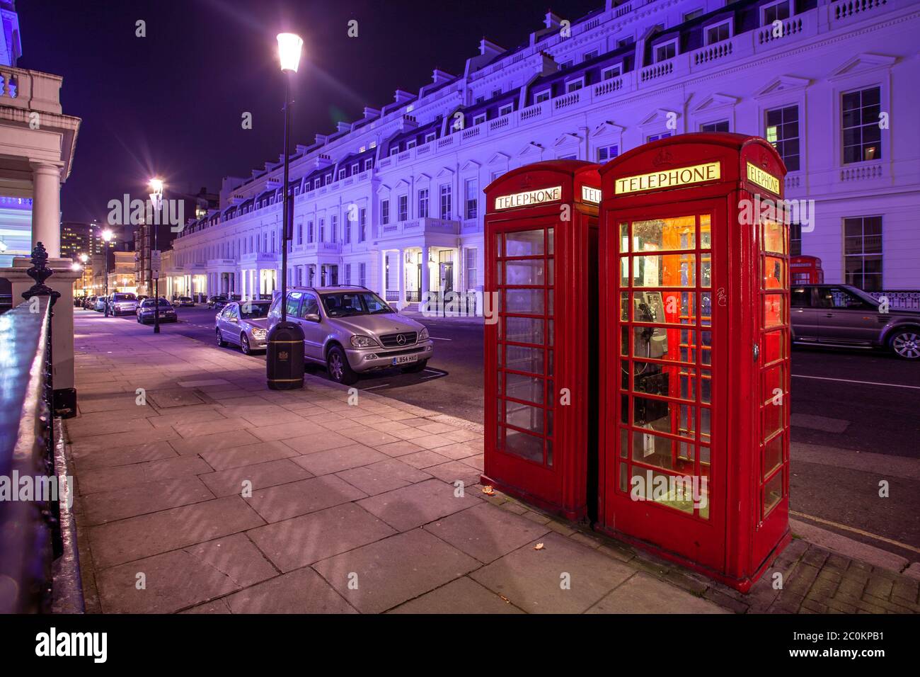 Typical red phone booths in the city of london hi-res stock photography ...
