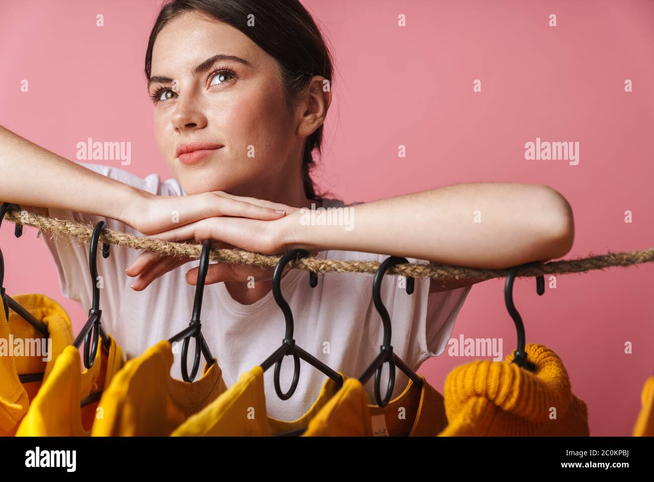 Photo of beautiful nice thinking woman looking upward while leaning on ...