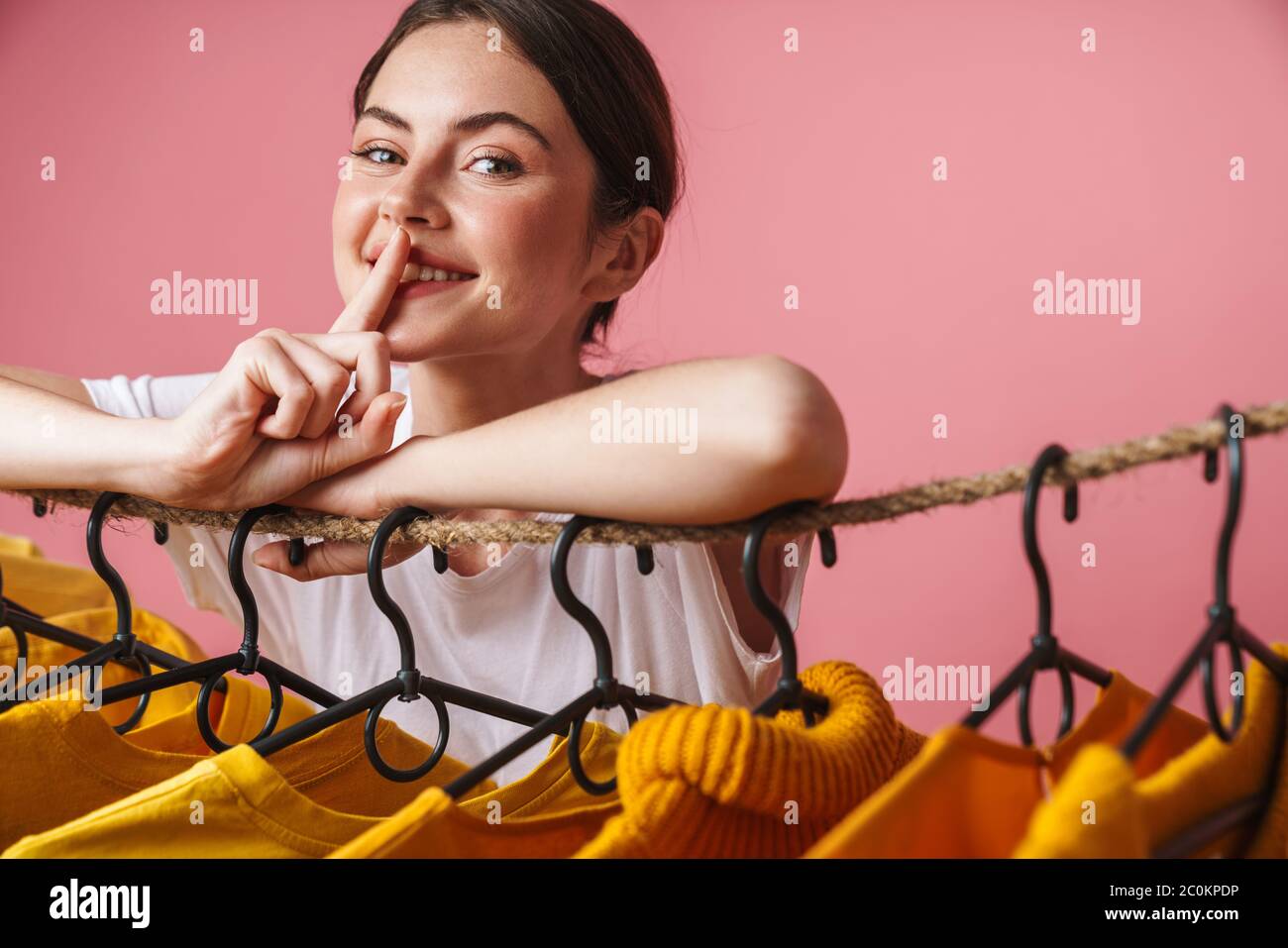 Photo of nice cheerful woman smiling and gesturing silence sing while ...