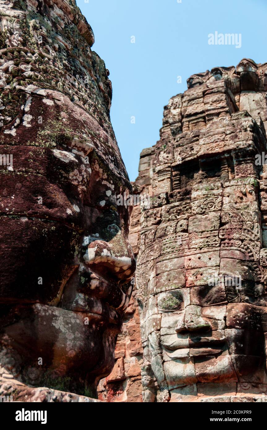 Head encarved in stone Bayon temple Angkor Stock Photo - Alamy