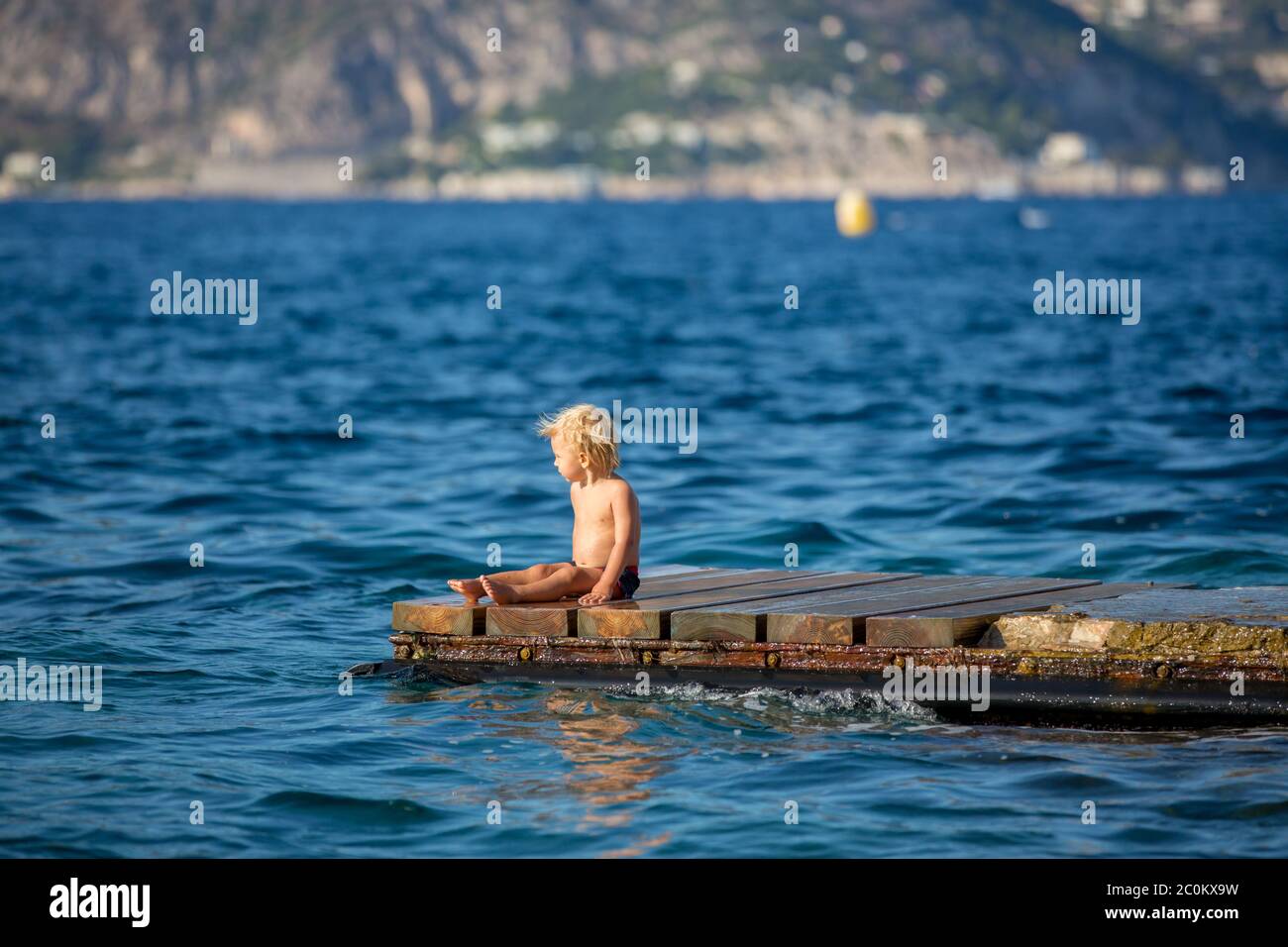 Kids Sitting On Dock High Resolution Stock Photography and Images - Alamy