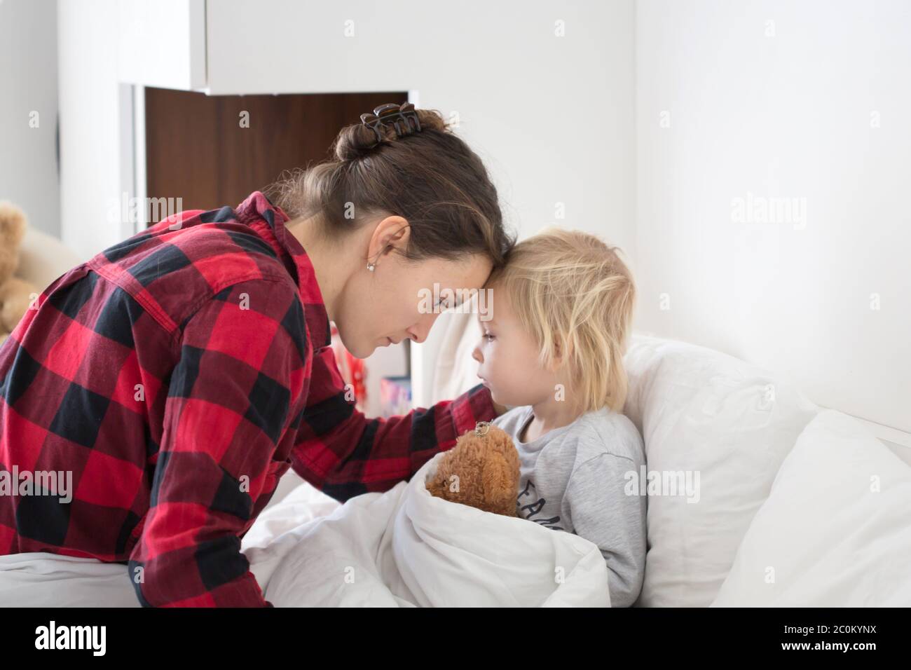 Boy in bed mother taking hi-res stock photography and images - Alamy