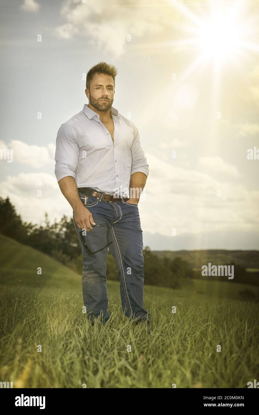 Serious man standing outdoors hi-res stock photography and images - Alamy