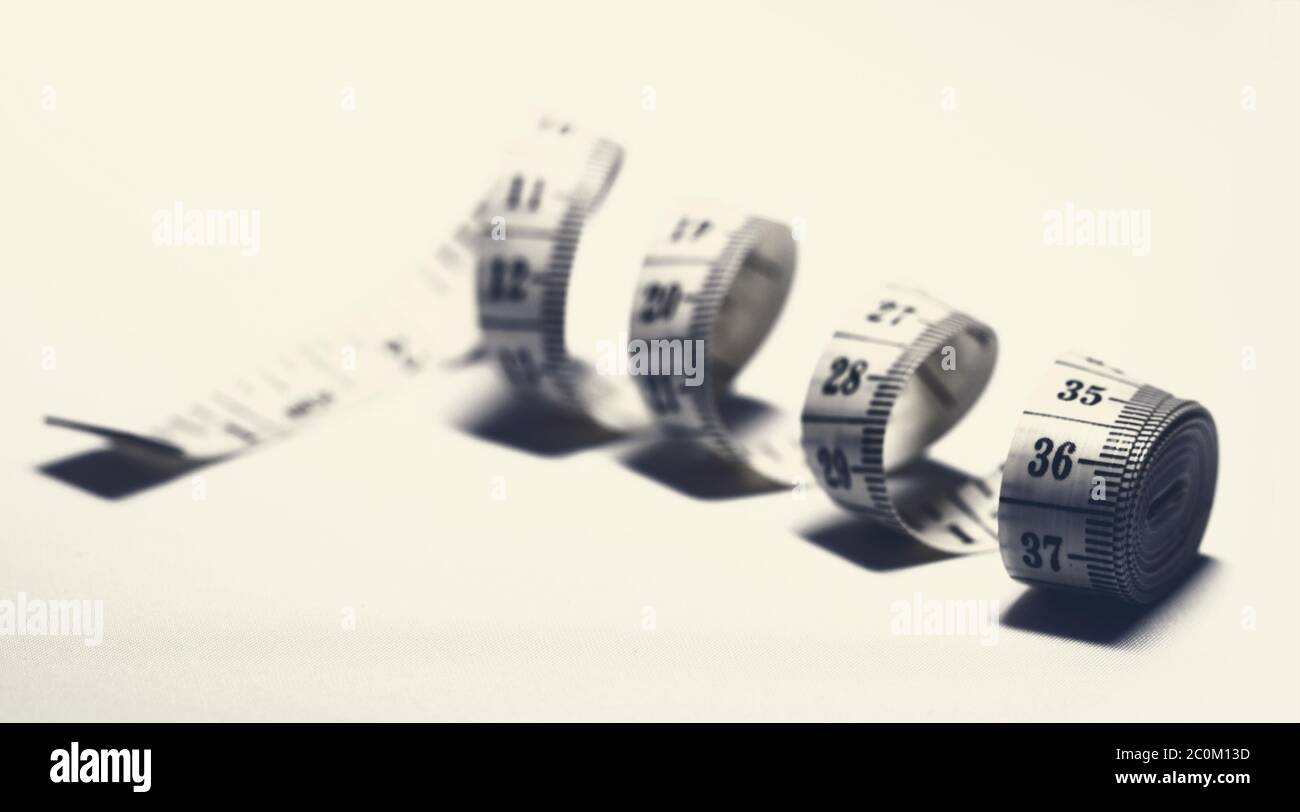 Photo of a white tape measure isolated Stock Photo - Alamy