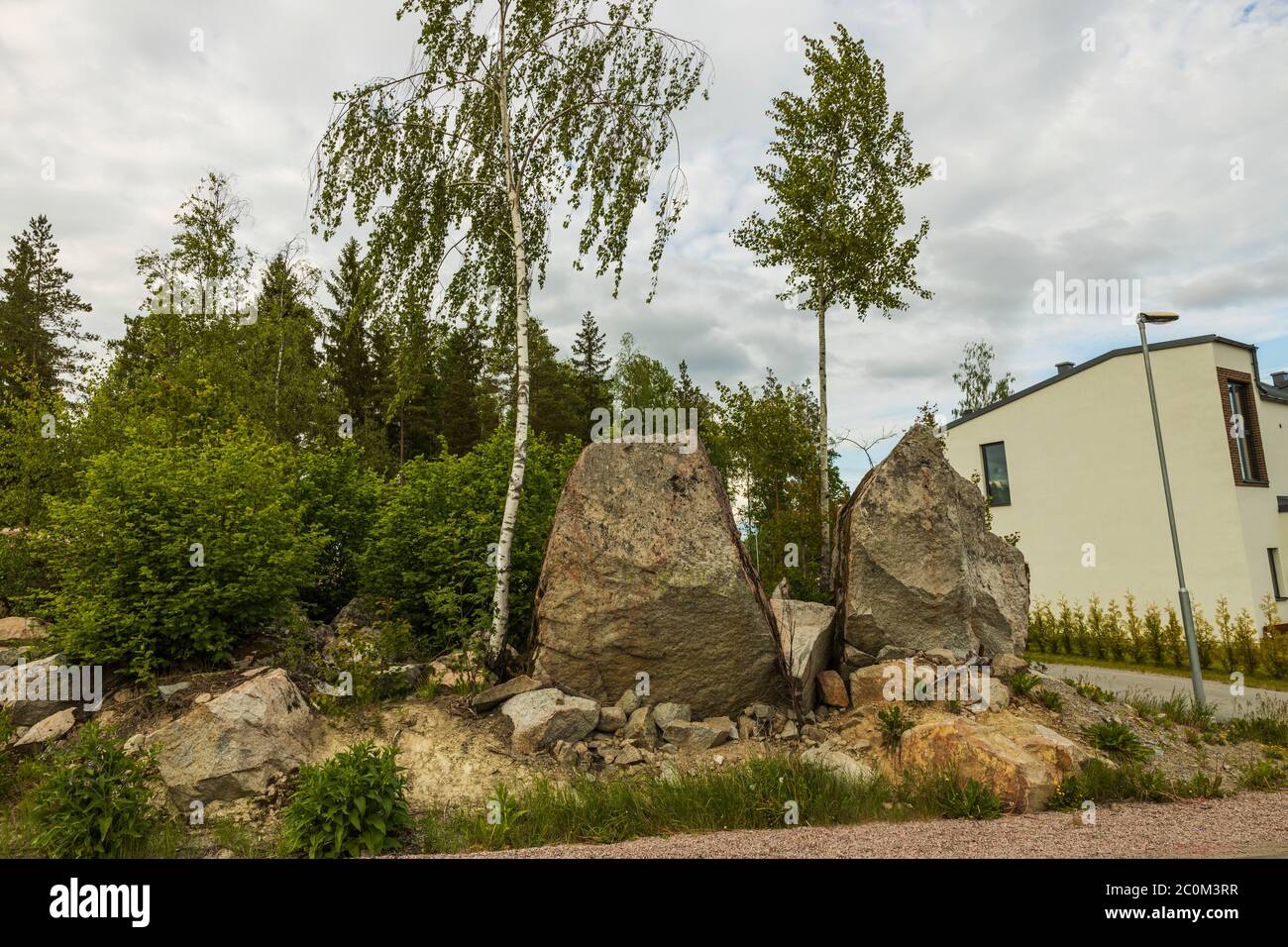 Beautiful view of rough rocky forest soil landscape on village street ...