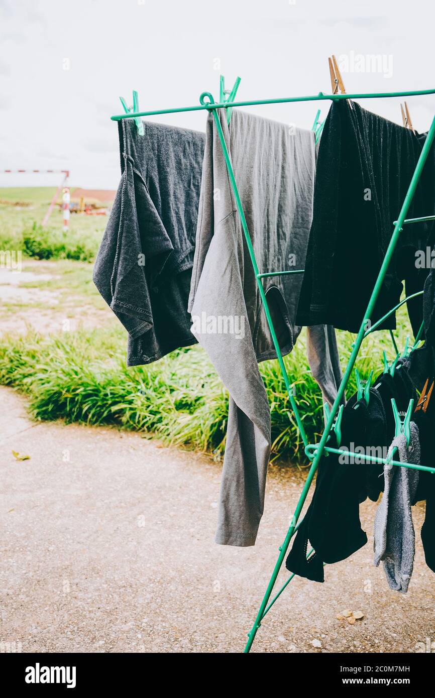 hanging out the clothes outdoors Stock Photo - Alamy