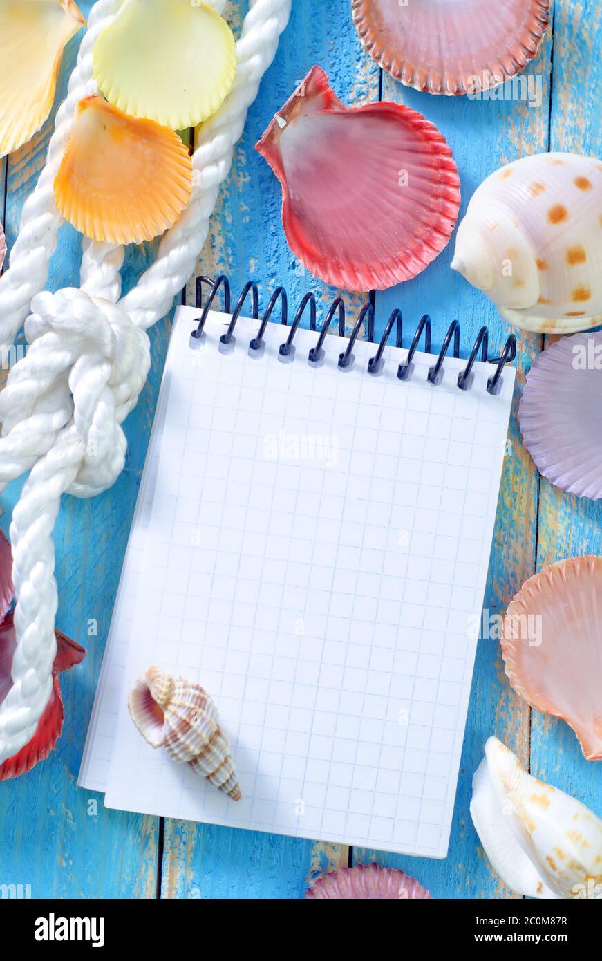 note and sea shell Stock Photo - Alamy