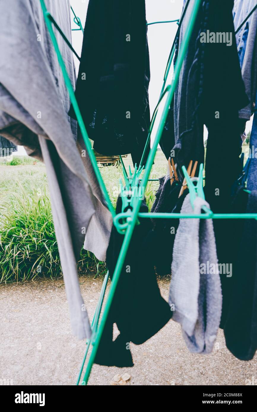 hanging out the clothes outdoors Stock Photo - Alamy
