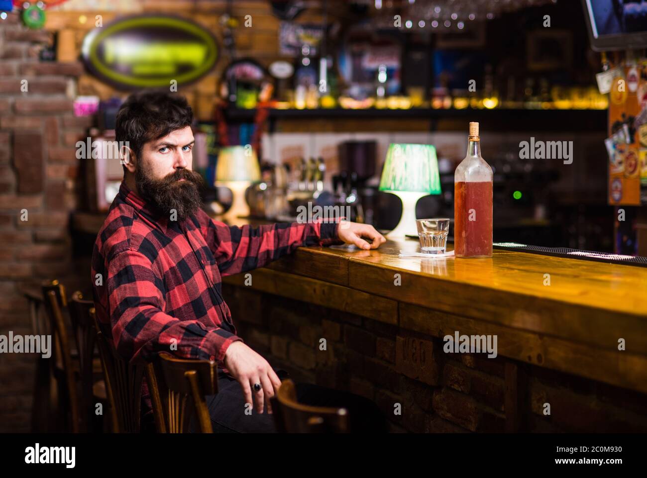 Guy spend leisure in bar, defocused background. Man with strict face ...