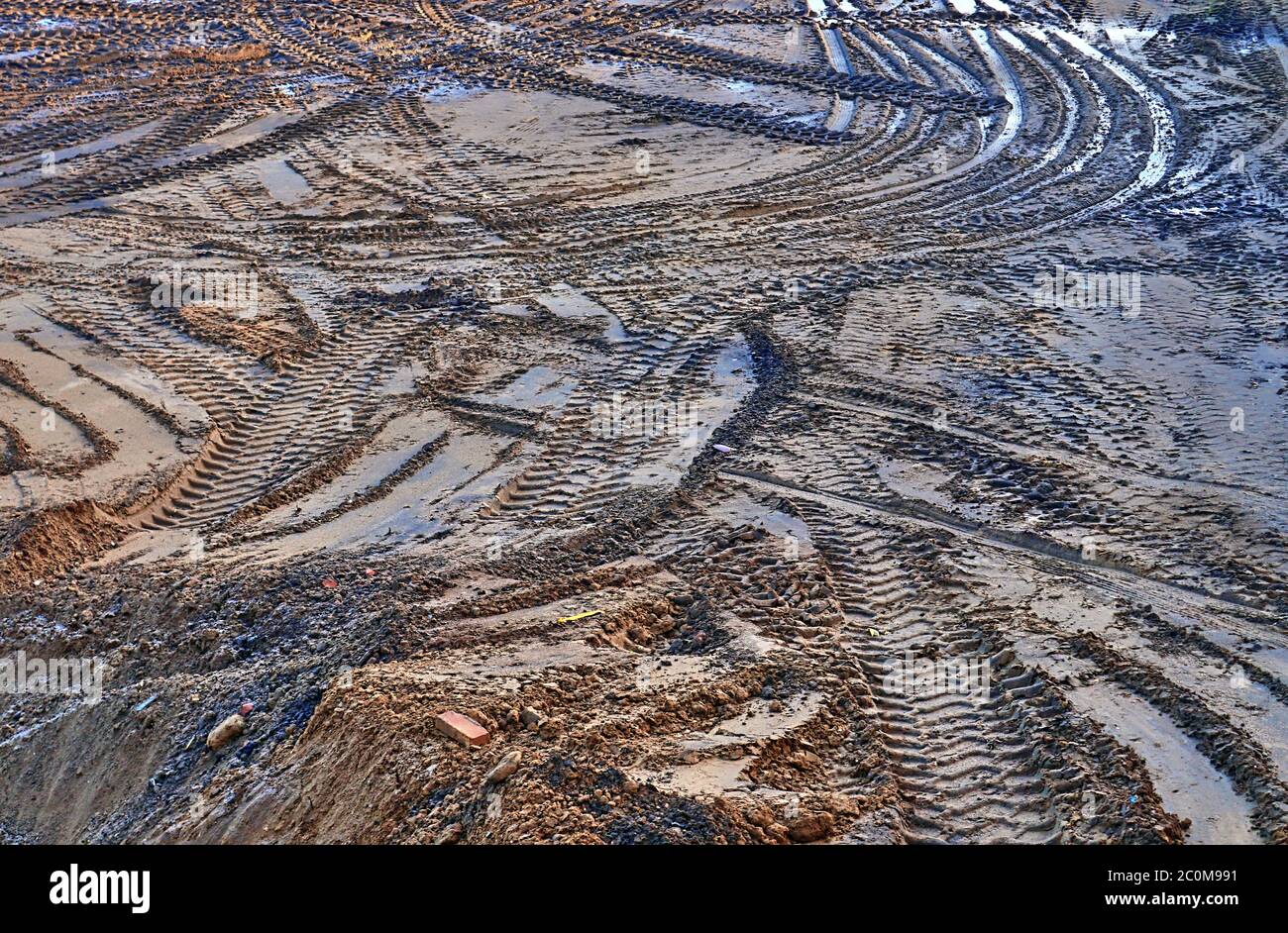 View into a gravel pit with piles of sand and tire tracks Stock Photo ...