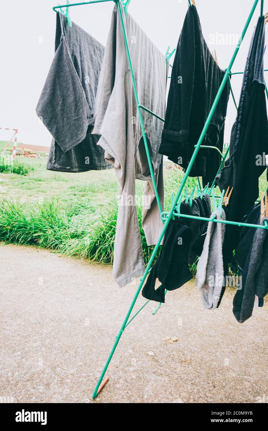 hanging out the clothes outdoors Stock Photo - Alamy