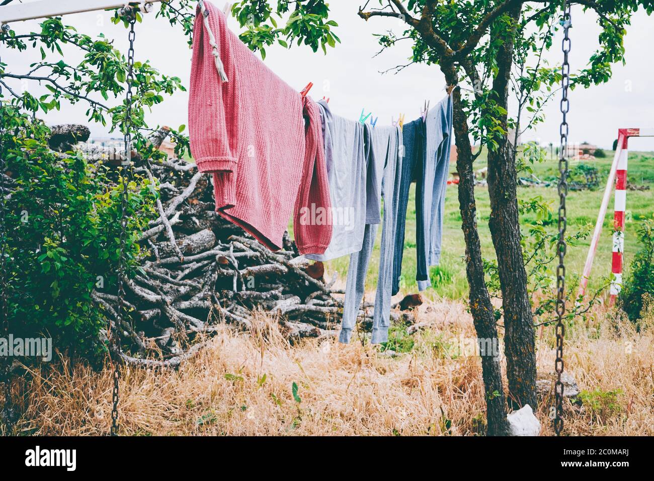 hanging out the clothes outdoors Stock Photo - Alamy