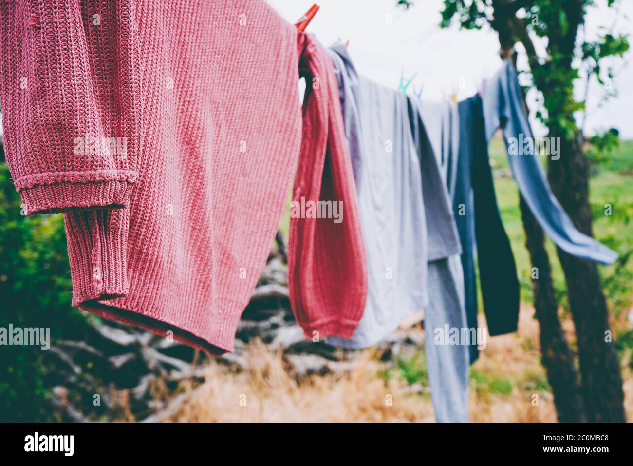 hanging out the clothes outdoors Stock Photo - Alamy
