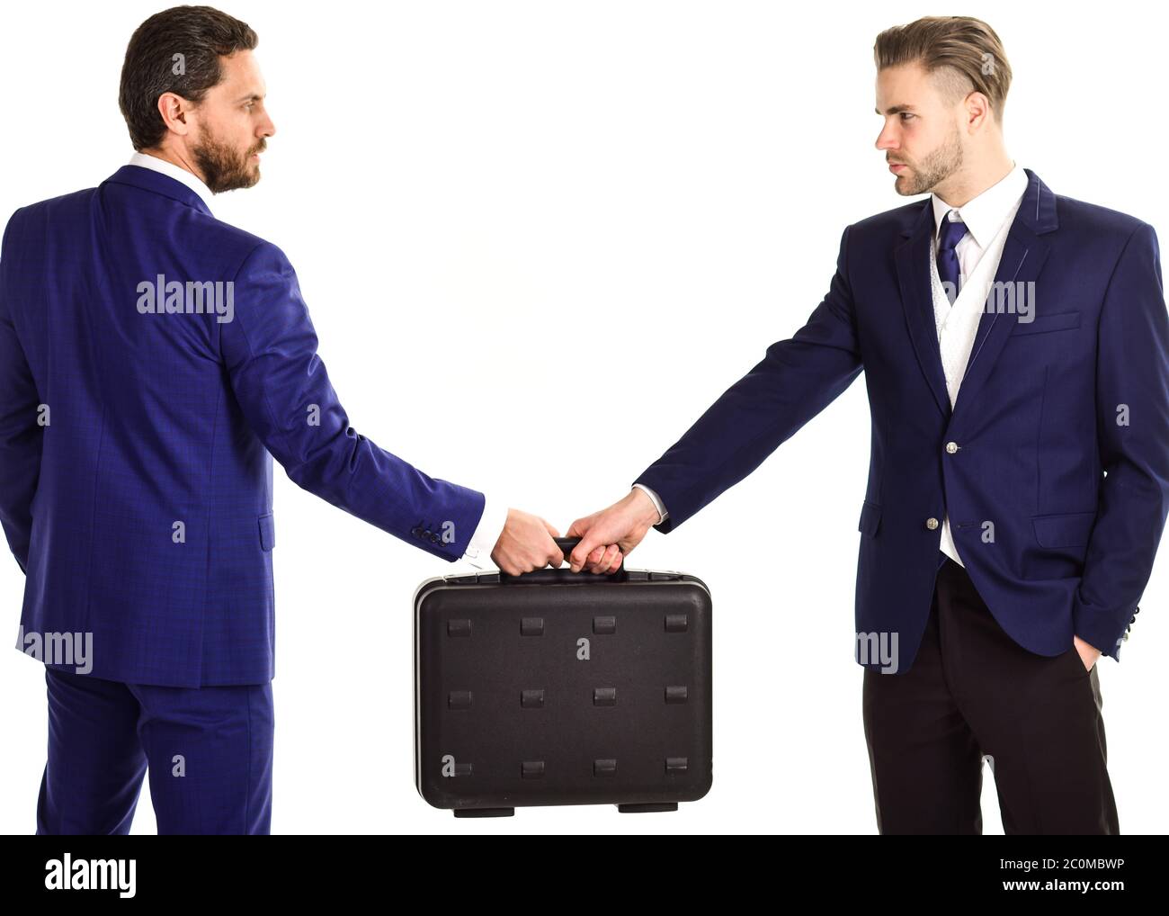 Business deal between businessmen in suits. Businessmen with serious ...
