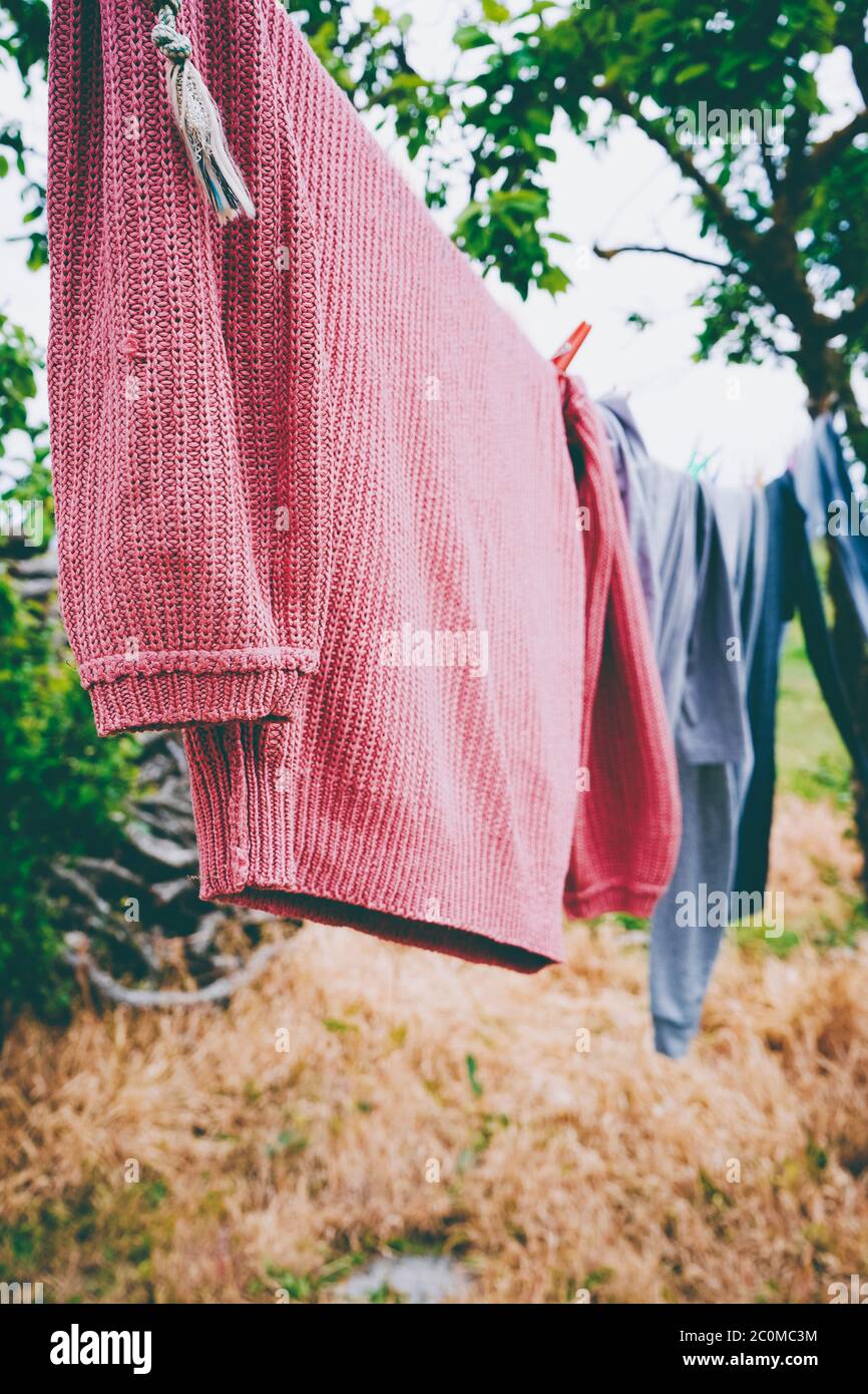 hanging out the clothes outdoors Stock Photo - Alamy
