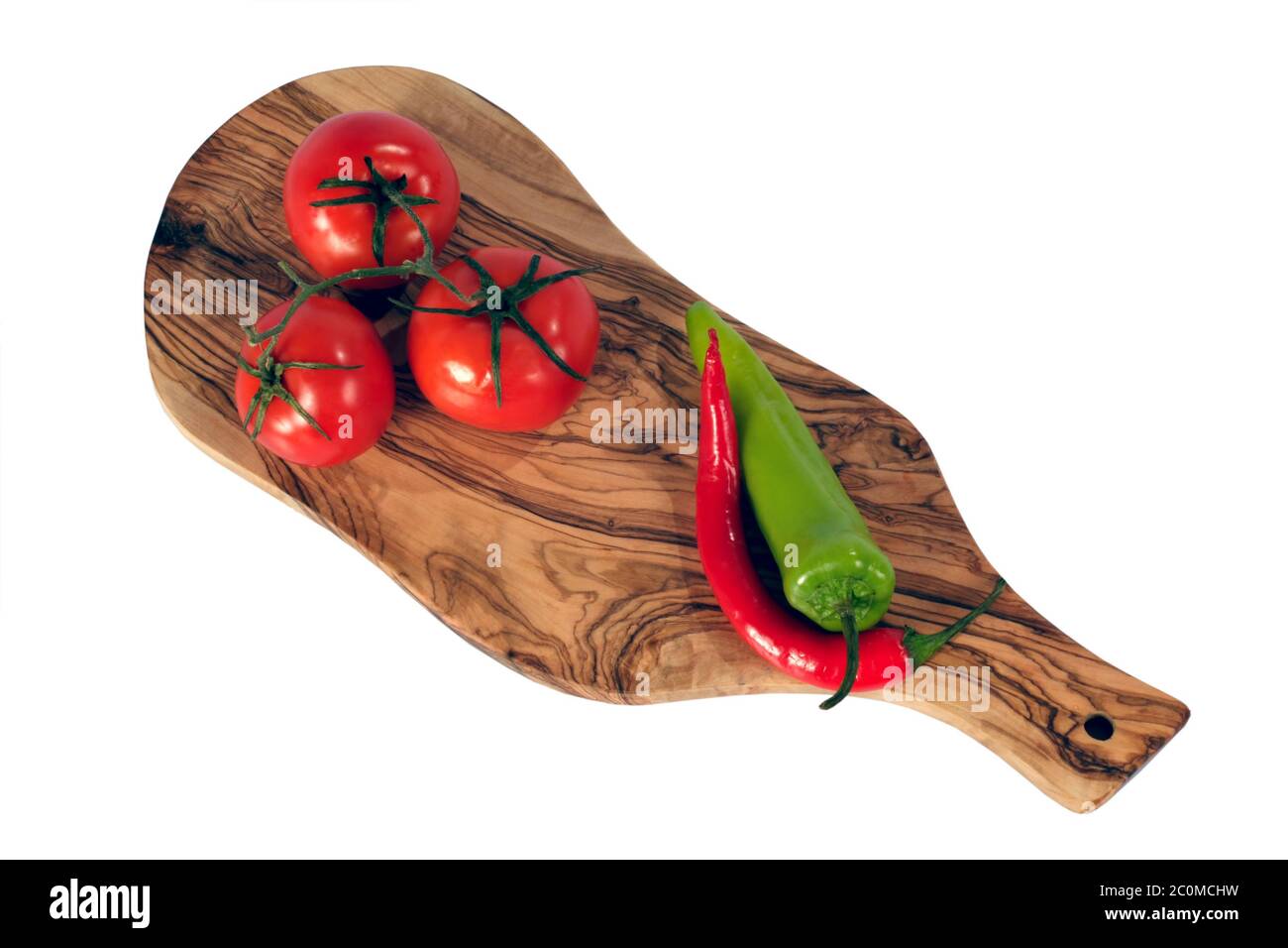 Three fresh red tomato and Chili pepper on breadboard Stock Photo - Alamy