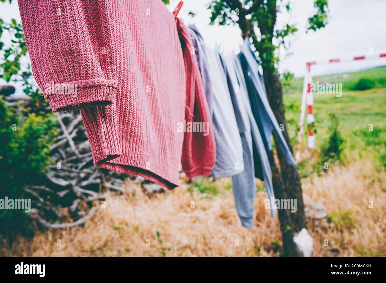 hanging out the clothes outdoors Stock Photo - Alamy