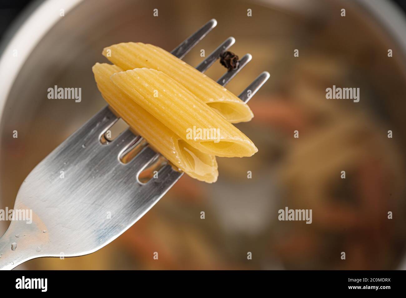 Cooking pasta at home in a pot close up Stock Photo - Alamy