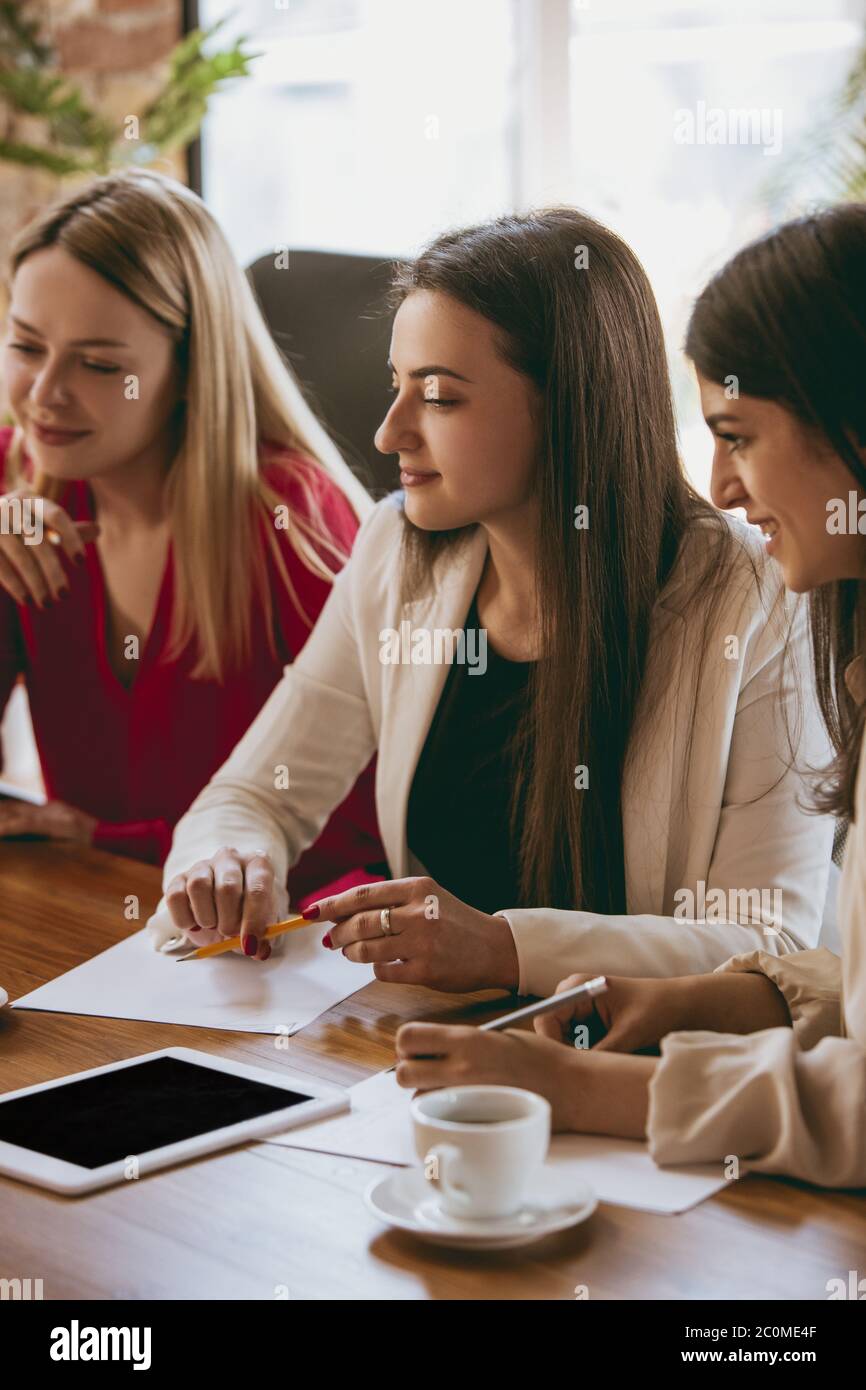 Paperwork. Young business woman in modern office with team. Creative ...