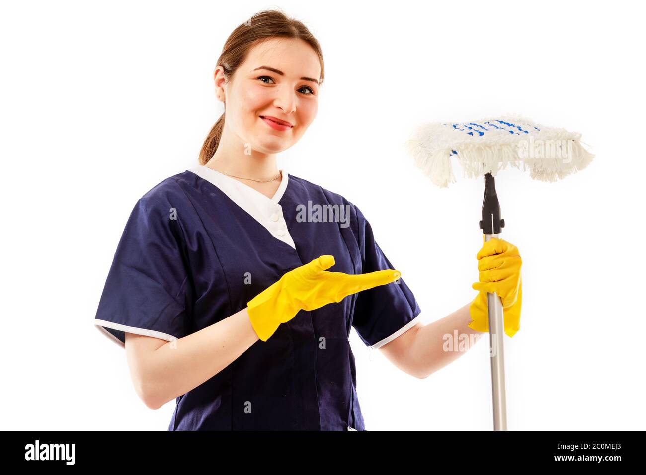 Cleaning woman pointing and showing your product or text isolated on ...